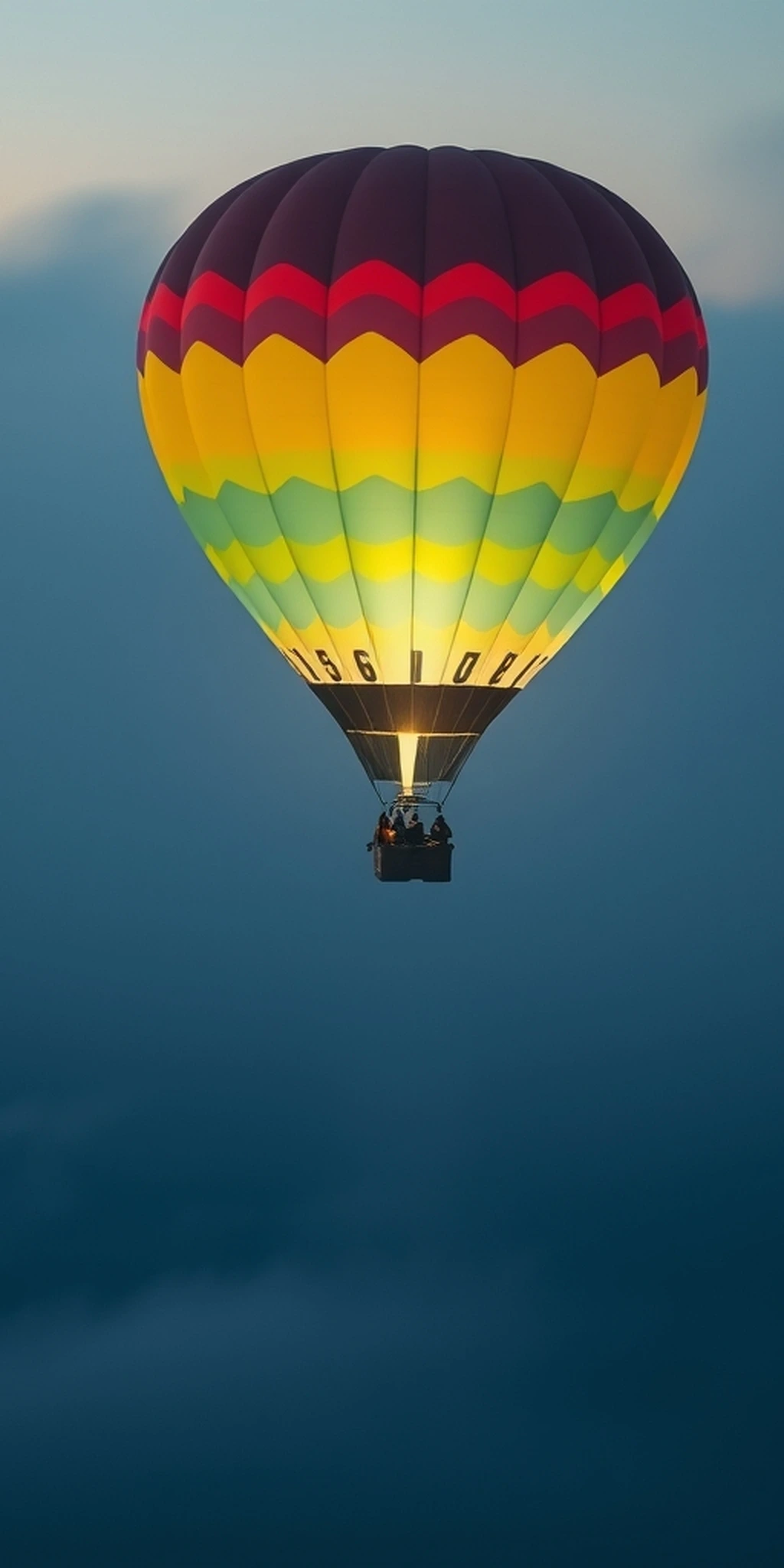 Colorful, Fully Illuminated Hot Air Balloon Flies Misty, Dark Ocean ...