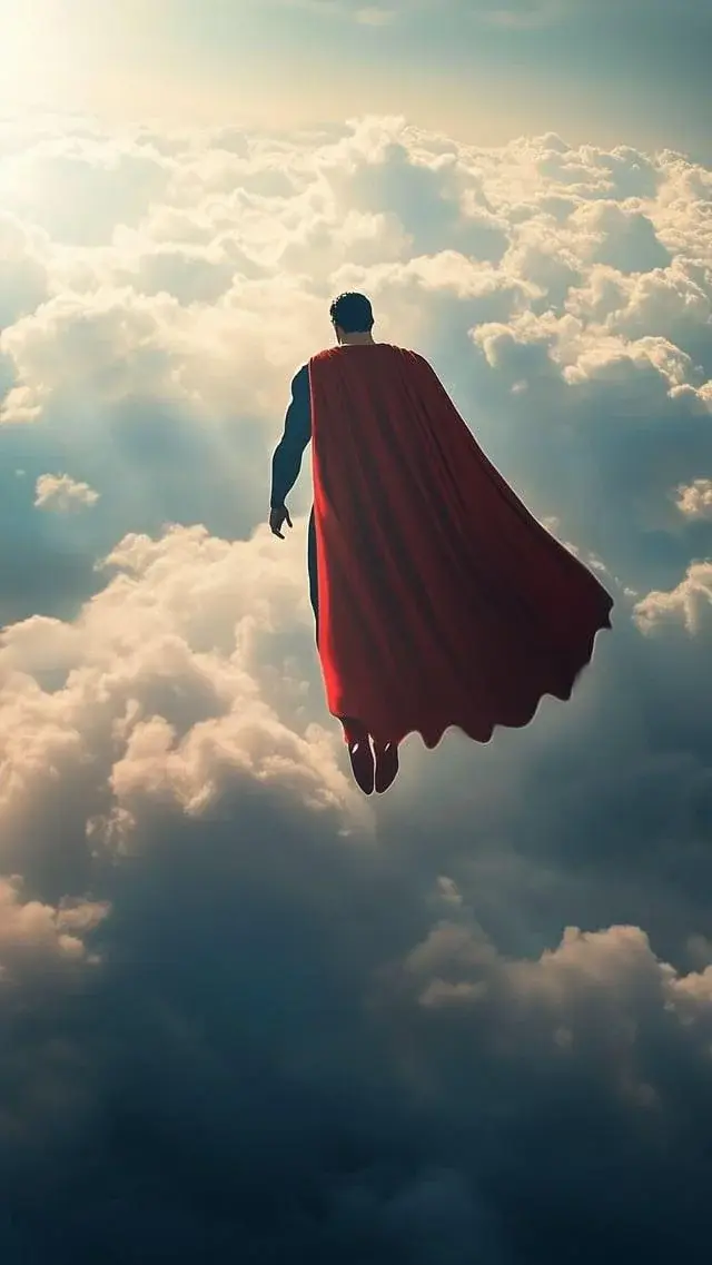 Superman Flying In The Clouds — Free iPhone Wallpaper (4K/HD) | 2025