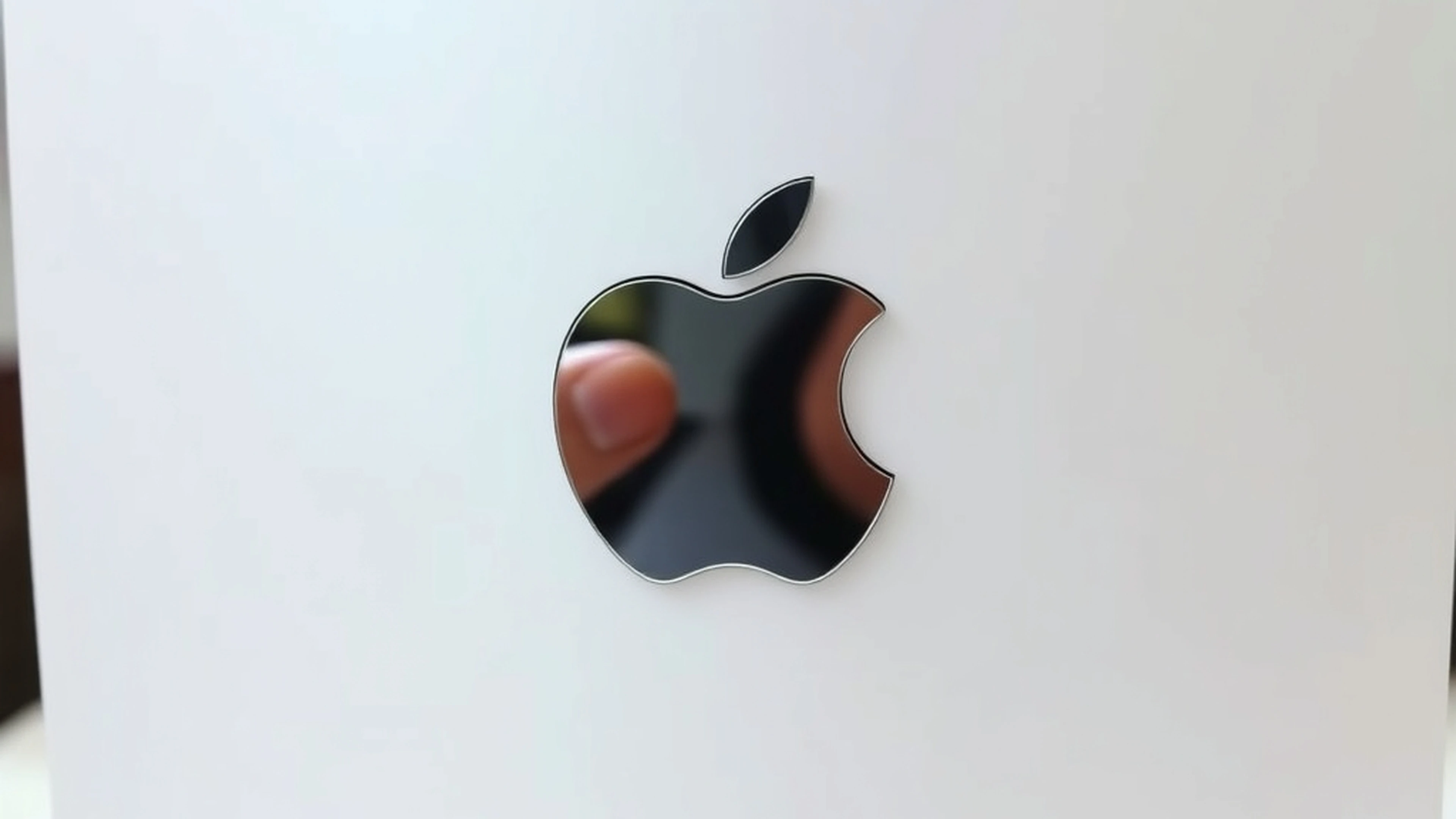 White With A Chrome Apple Logo In The Center — Free Mac or PC Wallpaper (4K/HD) | 2026